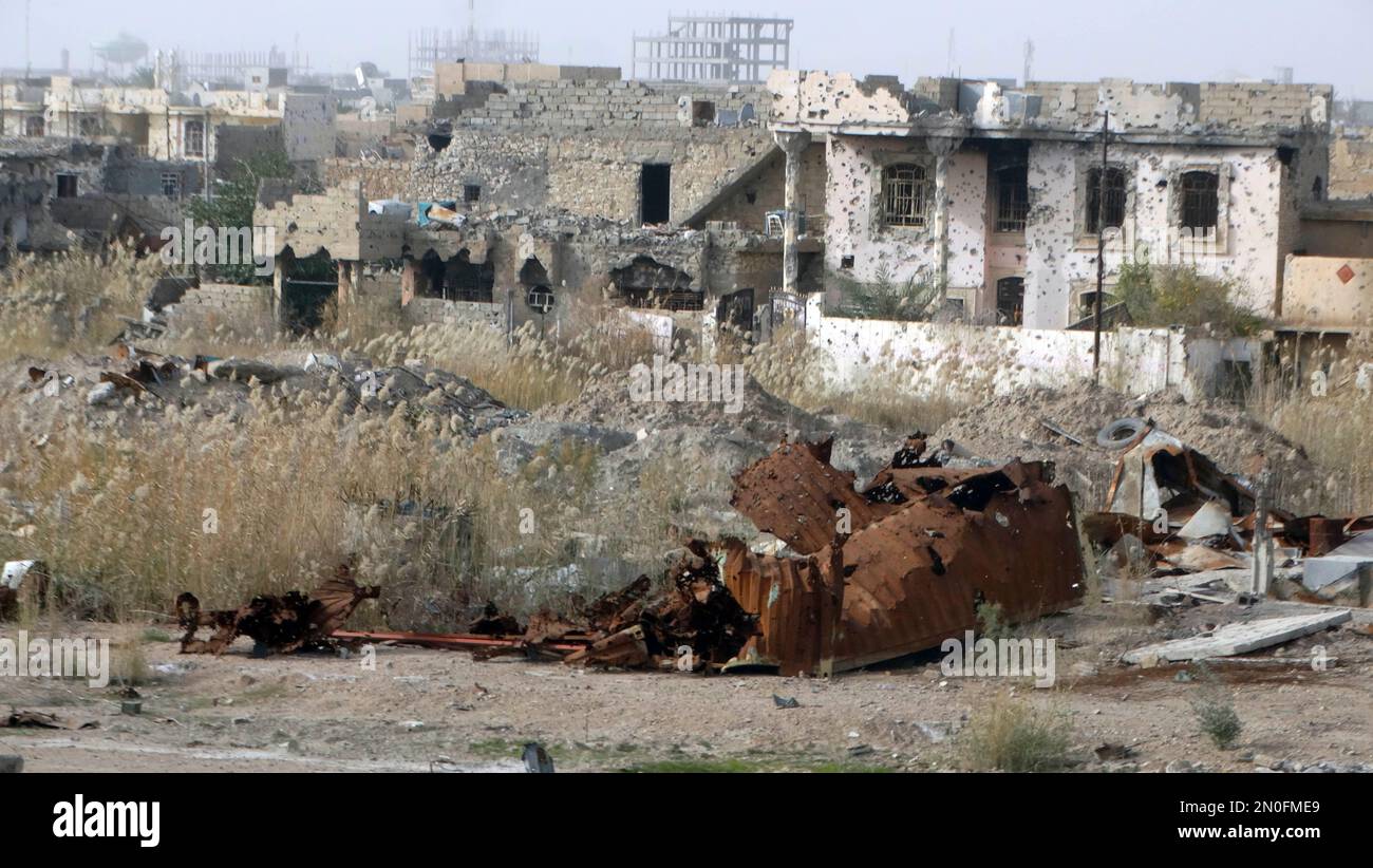 In this Tuesday, Jan. 19, 2016 photo, shows destroyed houses in Ramadi ...