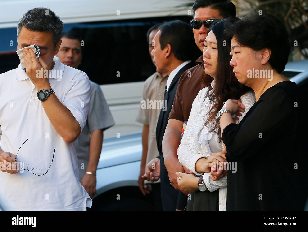 Chan Wai See, second from right, the widow of Malaysian hostage Bernard ...