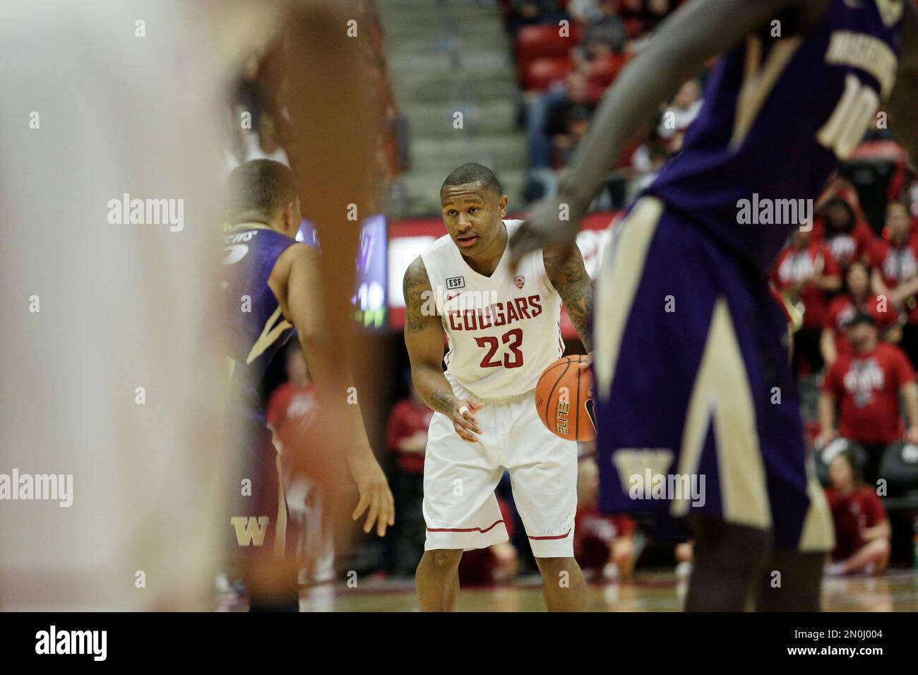 Washington State's Charles Callison (23) dribbles in front of ...