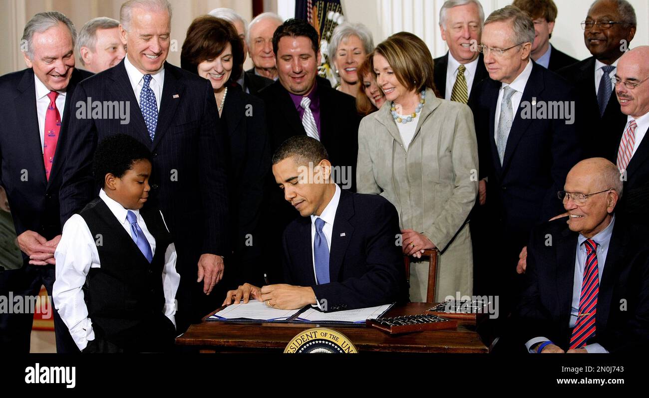 FILE - In this March 23, 2010 file photo President Barack Obama signs ...