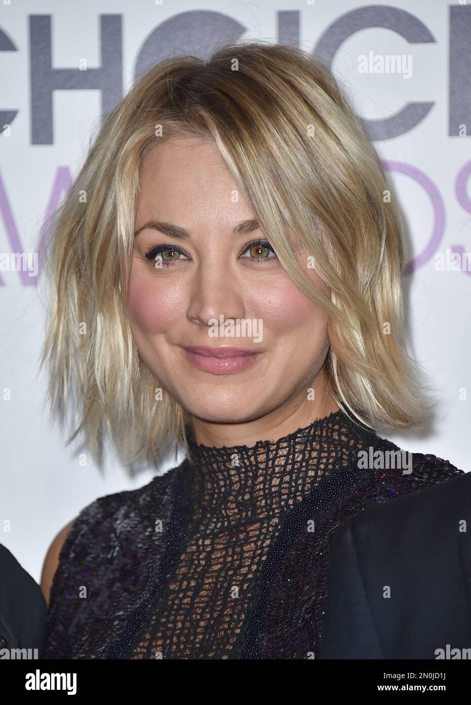 Kaley Cuoco poses in the press room with the award for favorite network ...