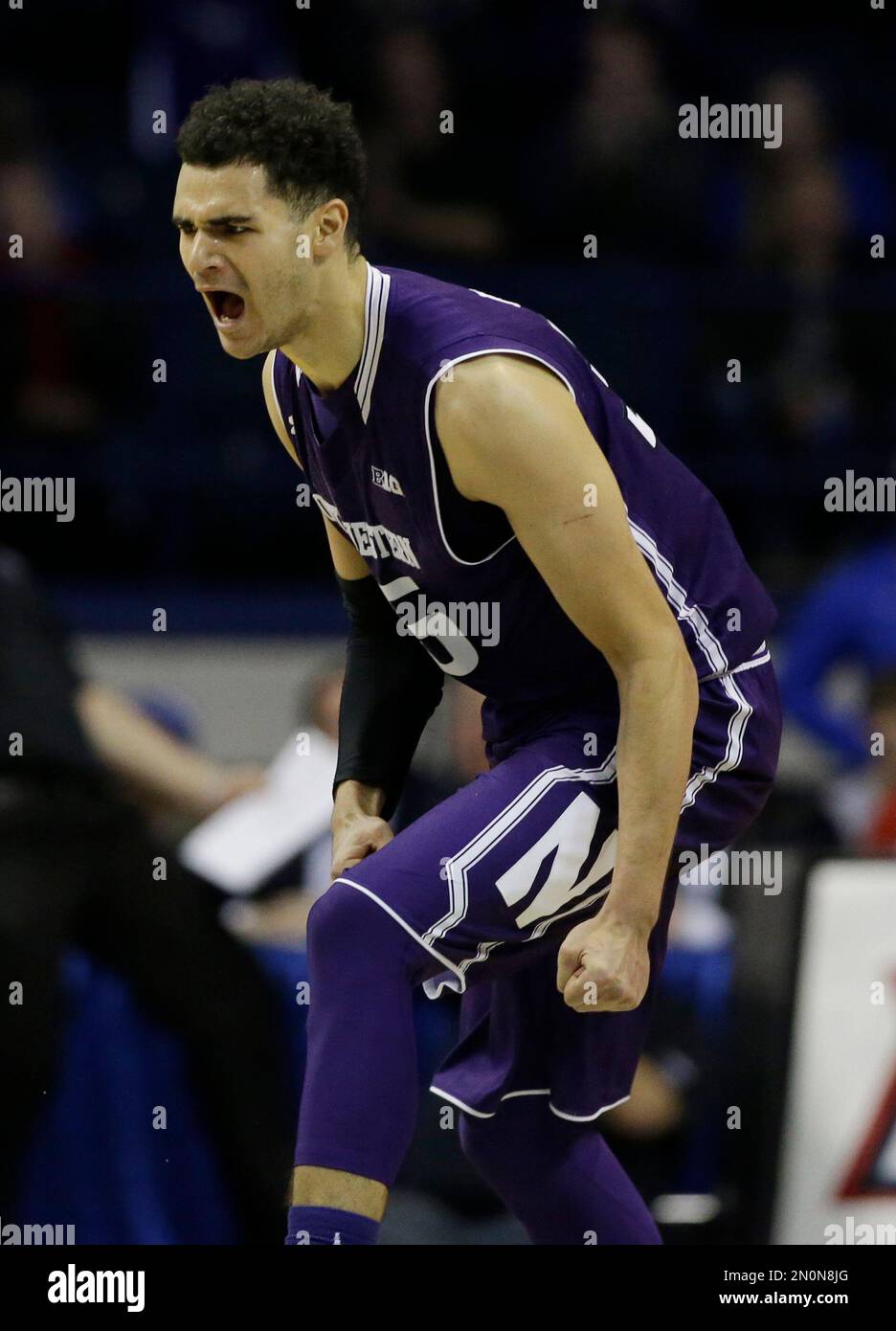 Northwestern forward Aaron Falzon (35) reacts after making a three ...