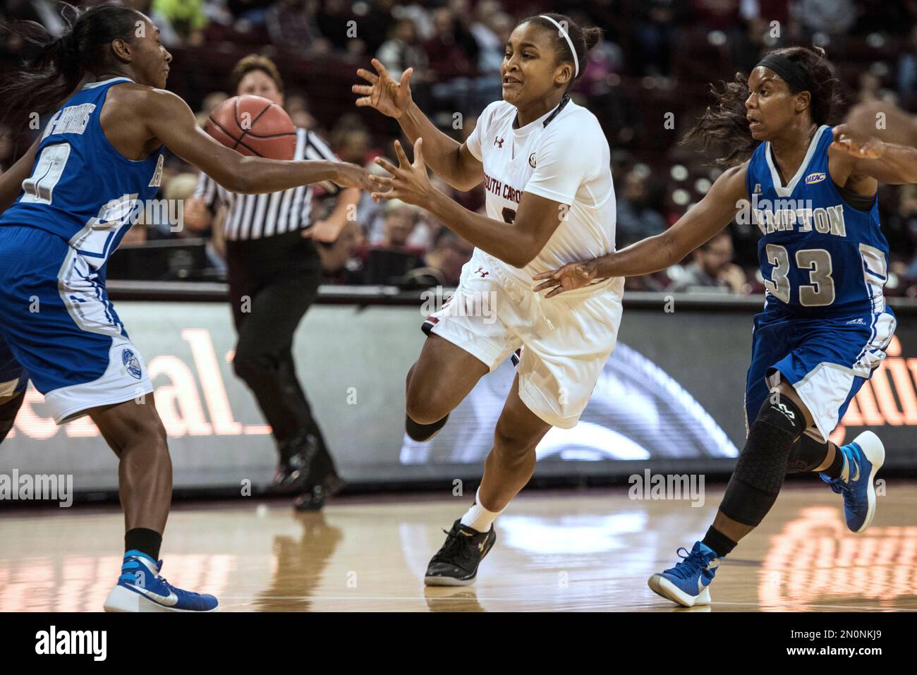 Pressured by Hampton guard Chanel Green (33), South Carolina guard Shay ...