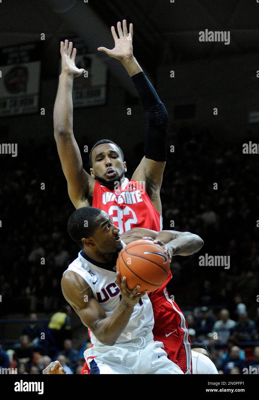 Connecticut's Rodney Purvis (44) is guarded by Ohio State's Trevor ...