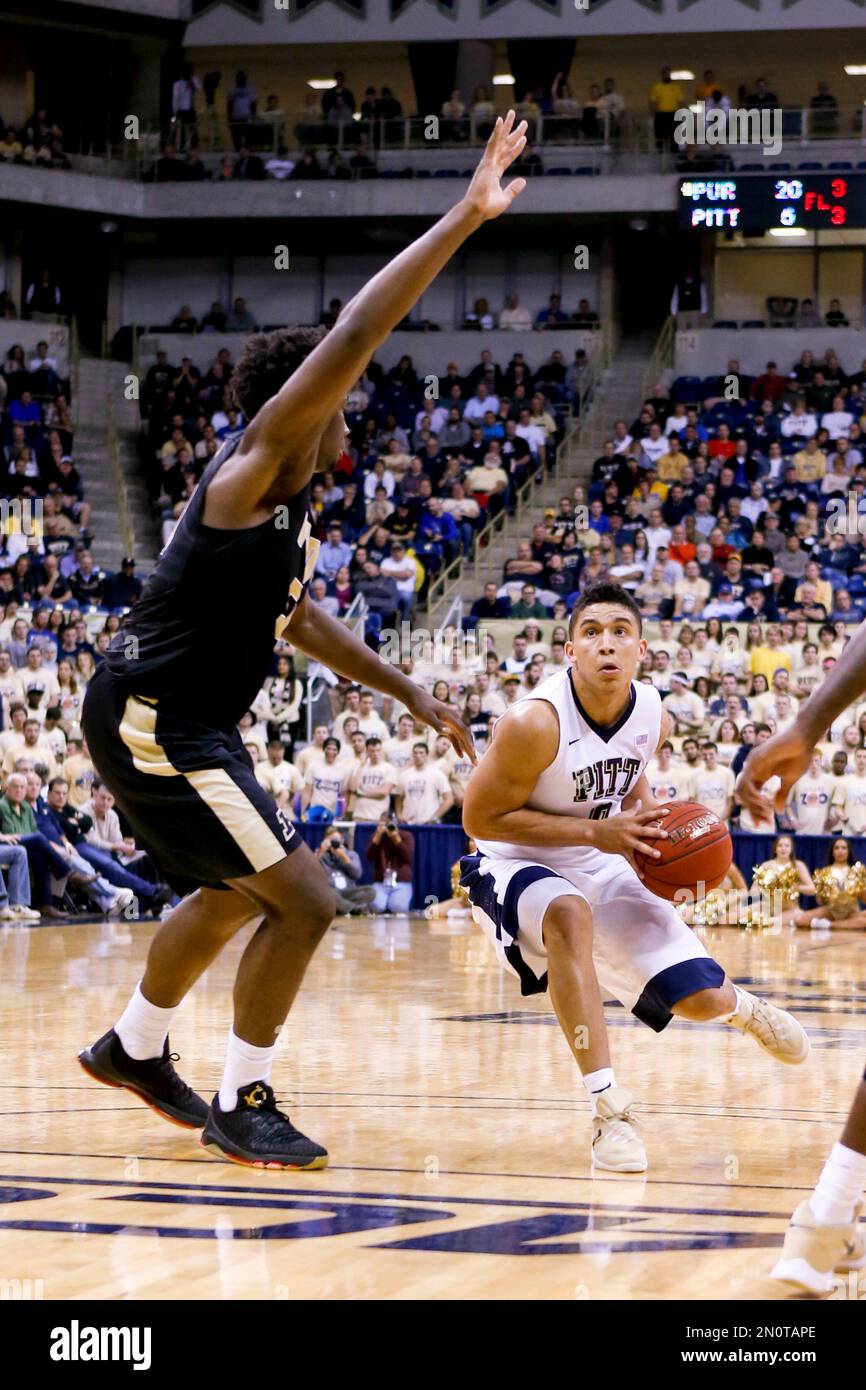 Pittsburgh's James Robinson, right, plays in an NCAA college basketball ...