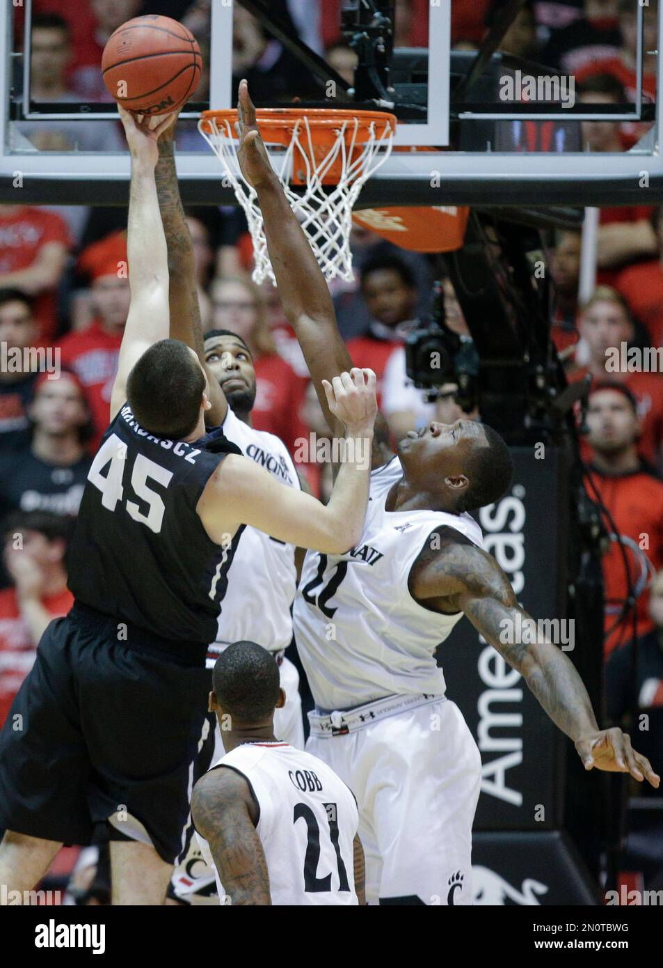 Butler's Andrew Chrabascz (45) shoots against Cincinnati's Octavius ...