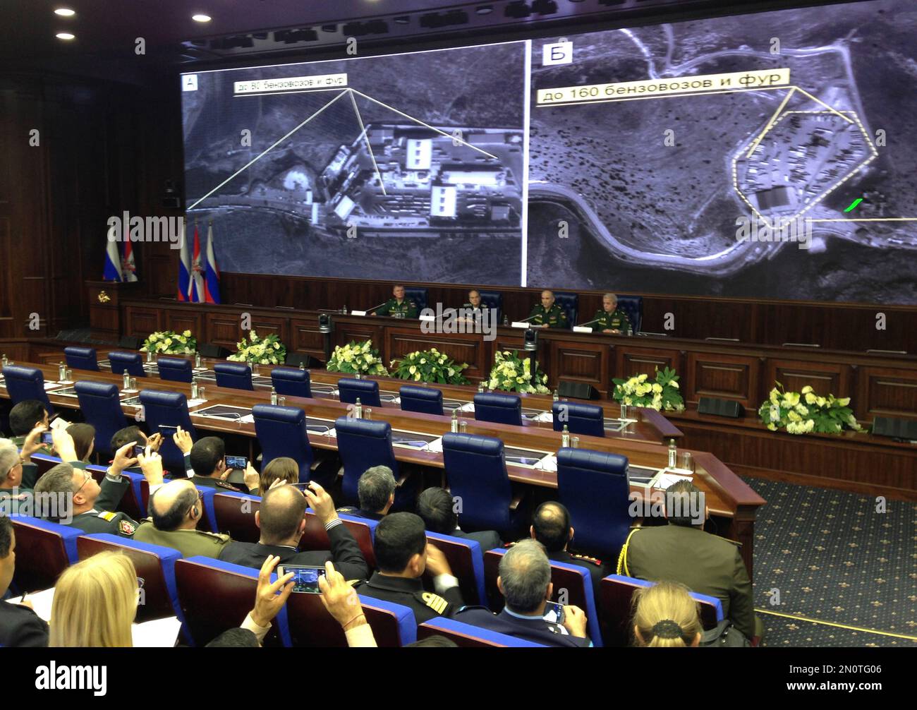 Russian top military officials speak to the media in front of an aerial ...