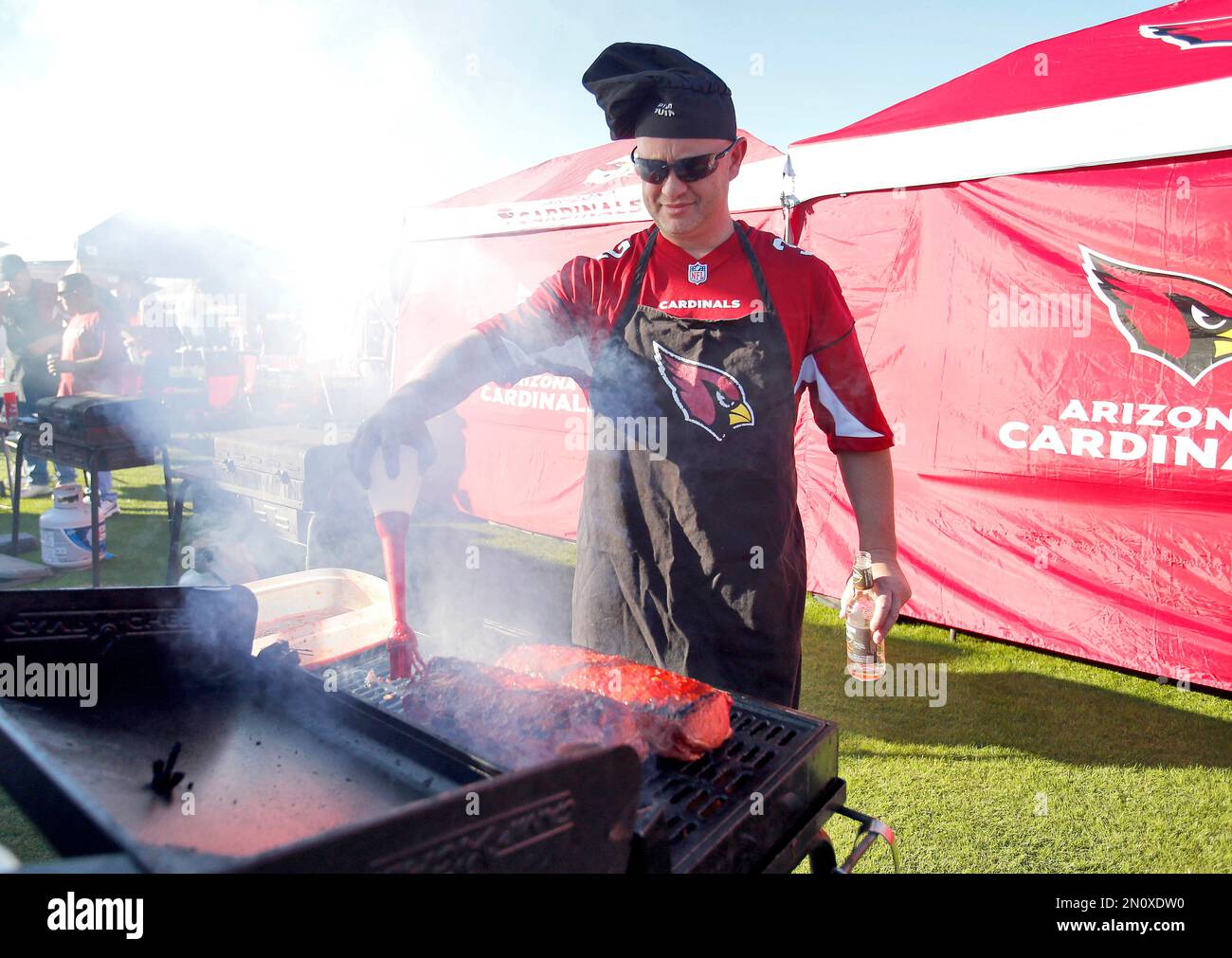 Kevin Mudd tailgates prior to an NFL football game between the Arizona ...