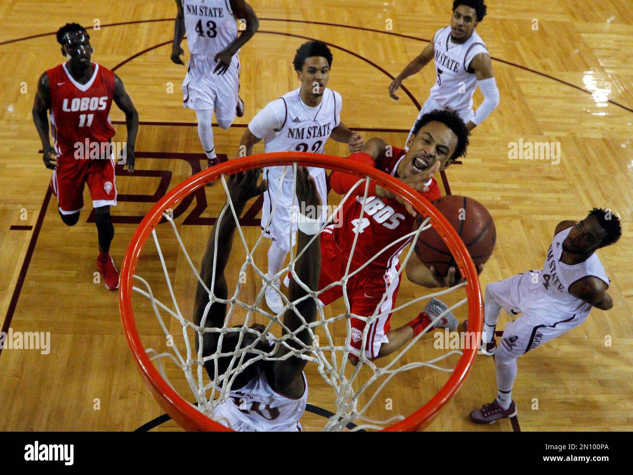 New Mexico guard Elijah Brown goes up for a basket as New Mexico State ...