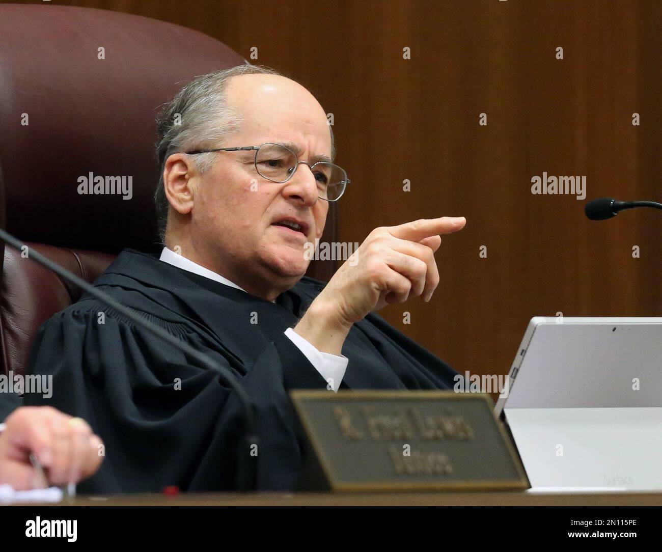 Florida Supreme Court justice Charles Canady asks a question of a ...