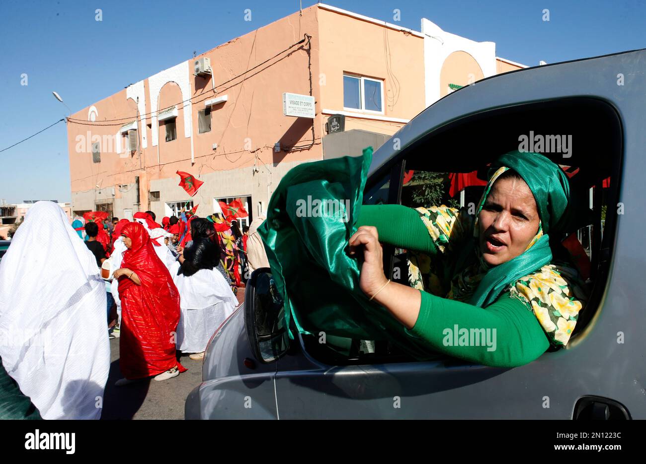 Moroccan women parade in a street of Laayoune, the capital of disputed ...