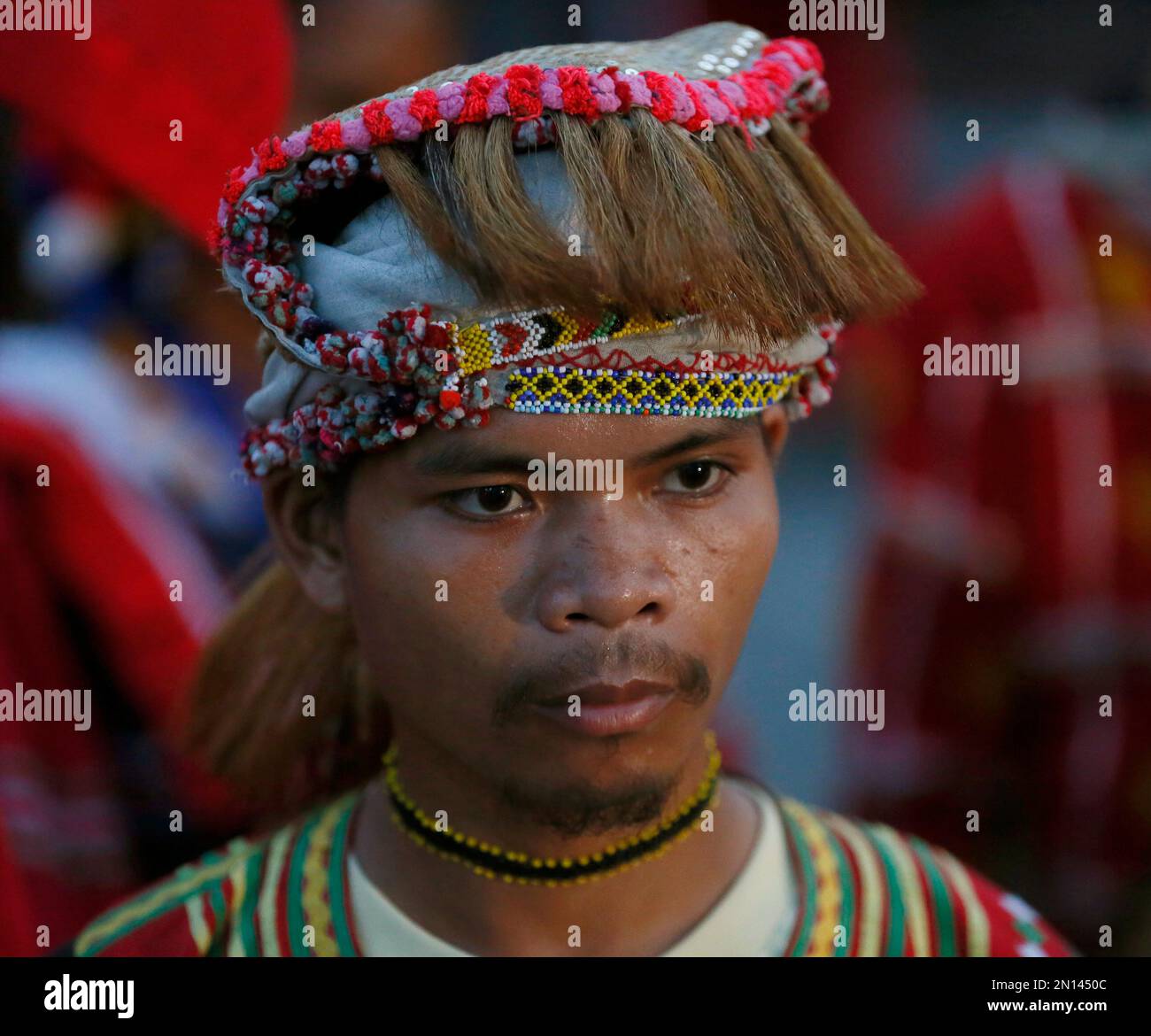 An indigenous man collectively known as "Lumad" joins a protest by ...