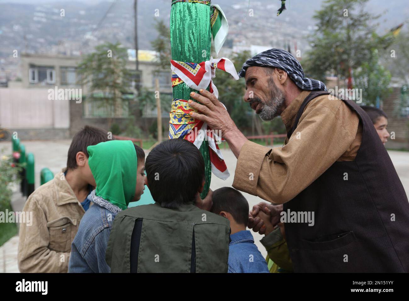 Afghans kisses a holy mace for blessings during activities marking the ...