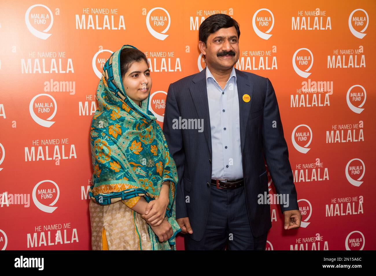 Malala Yousafzai and Ziauddin Yousafzai pose for photographers upon ...