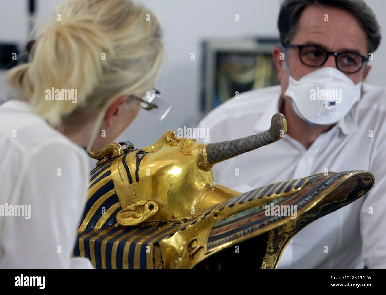 German restorers Christian Eckmann, right, and Katja Broschat examine ...