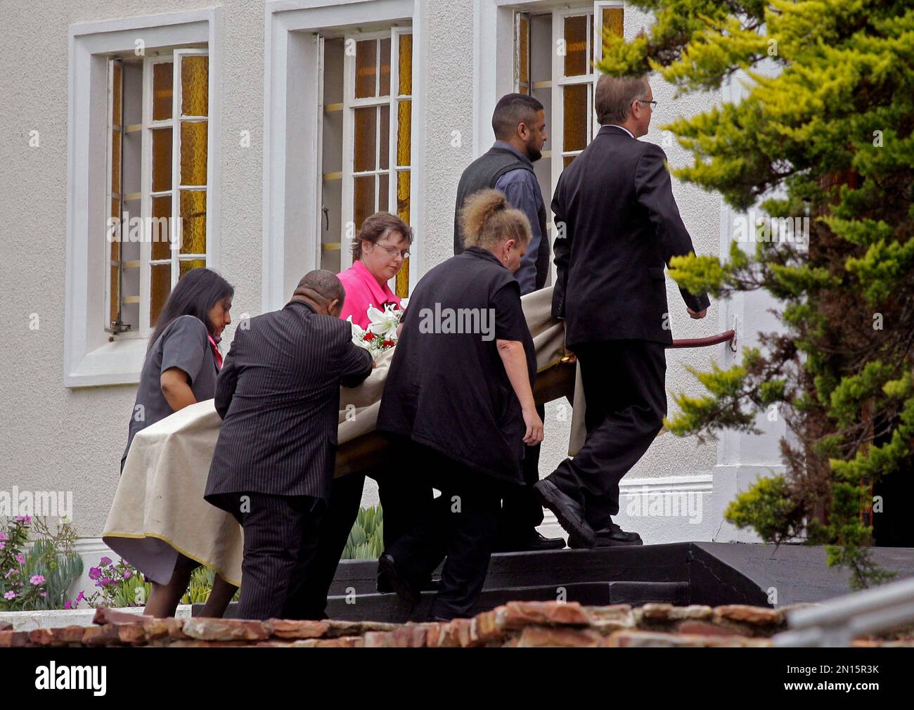 FILE - In this Tuesday, Feb. 19, 2013 file photo pallbearers carry the ...