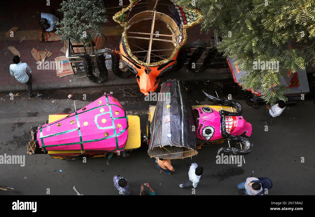 Indians carry a huge effigy of the ten-headed demon god Ravana in ...