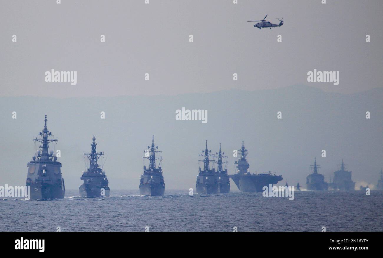 Japan Maritime Self-Defense Force destroyer "Atago," left, leads other ...