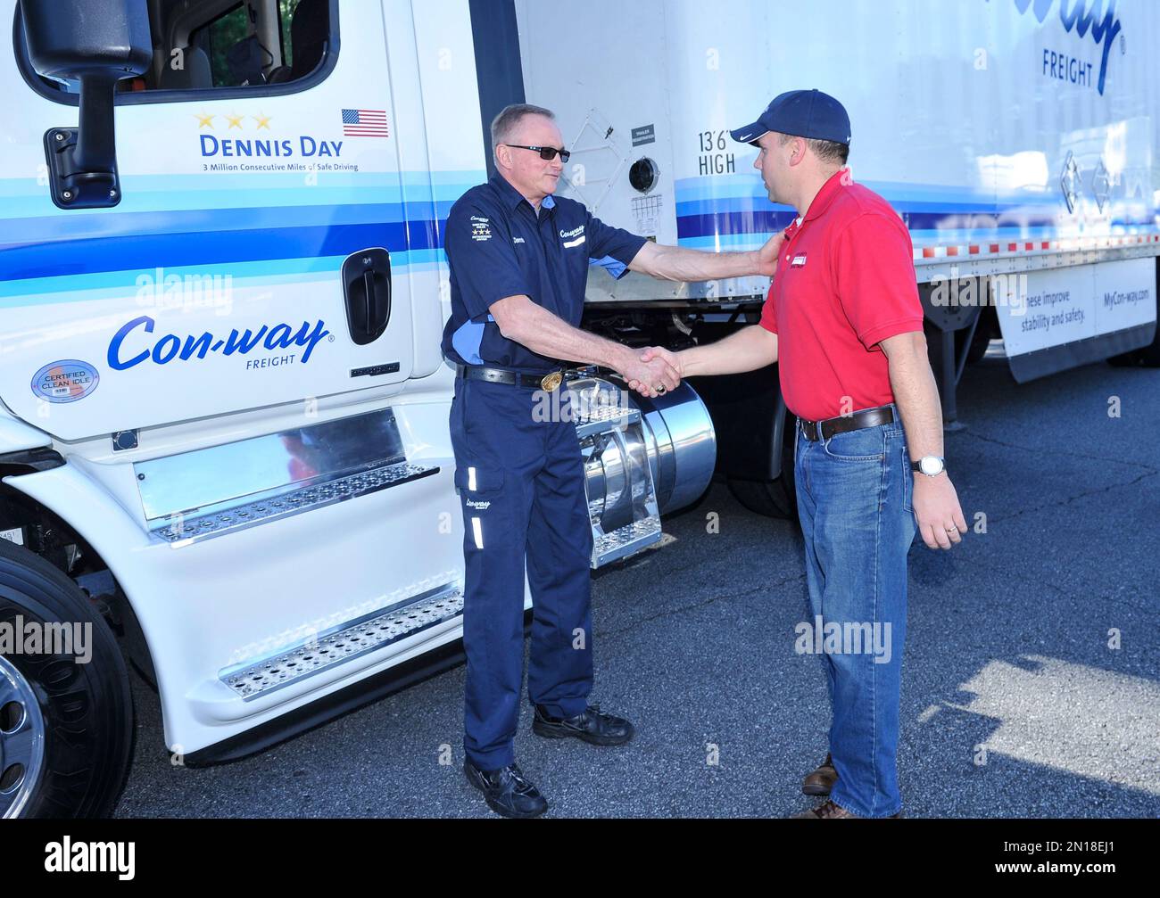 Con-way Freight professional driver Dennis Day, left, is congratulated ...
