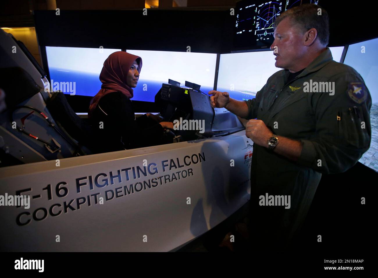 Lockheed Martin's Chief Test Pilot for F-16 Paul "Bear" Randall, right ...