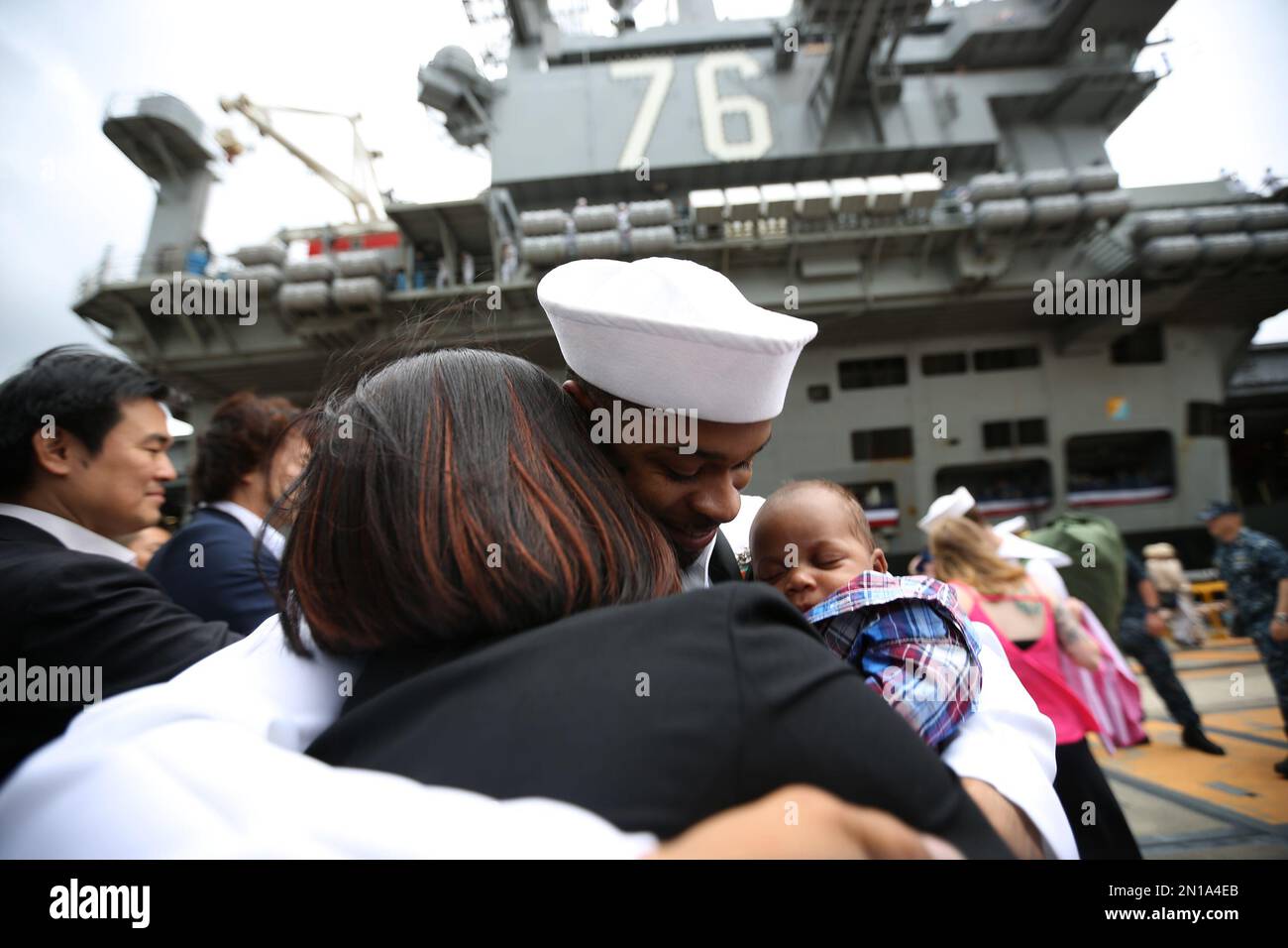 Crew members of U.S. navy nuclear-powered aircraft carrier USS Ronald ...
