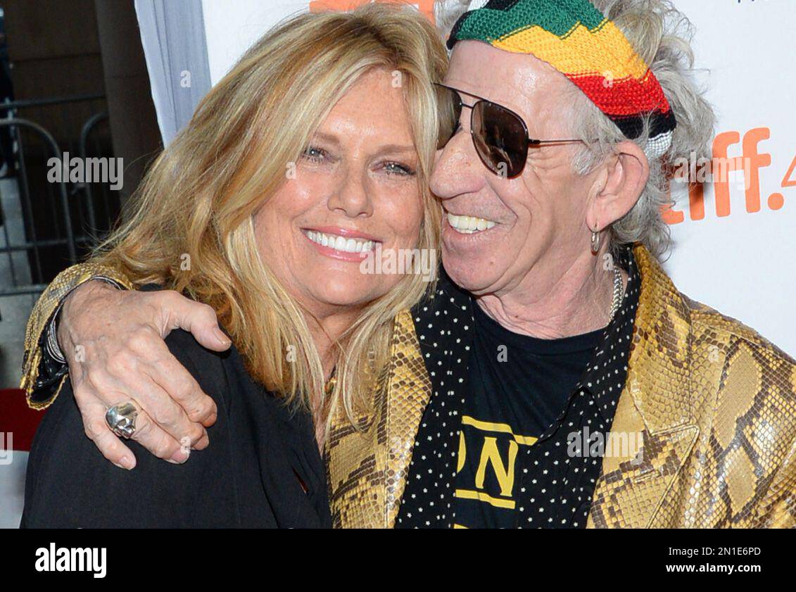 Keith Richards, right, and his wife Patti Hansen attend a premiere for ...