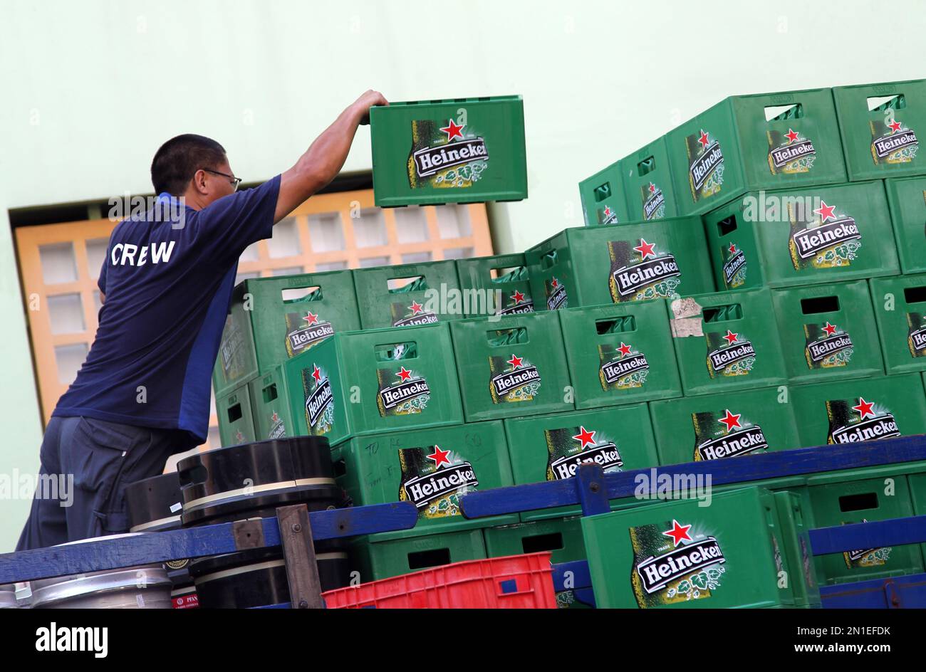 FILE - In this Aug. 14, 2012 file photo,a worker unloads a truck ...