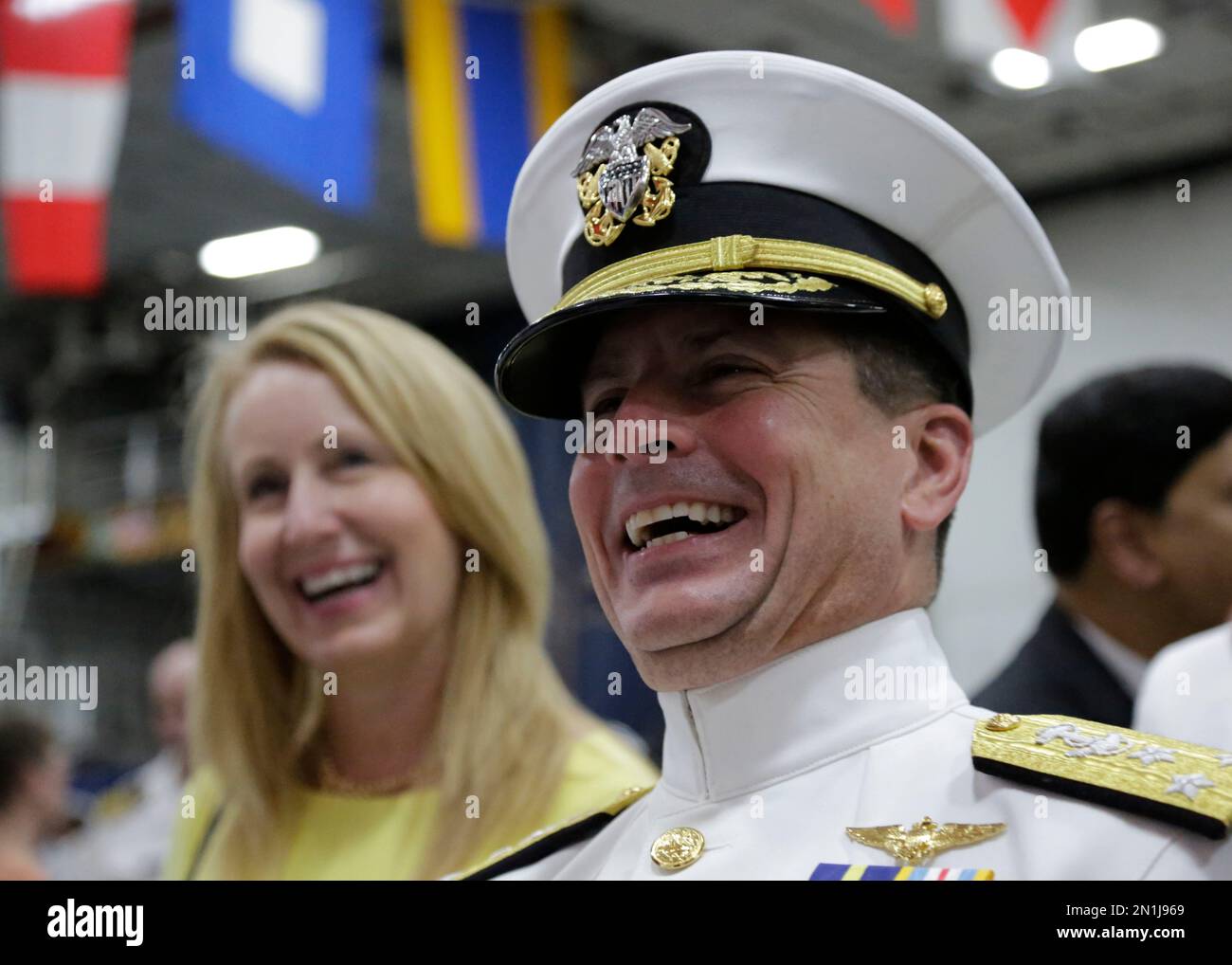 Vice Admiral Kevin Donegan and his wife Debra Donegan smile during a ...