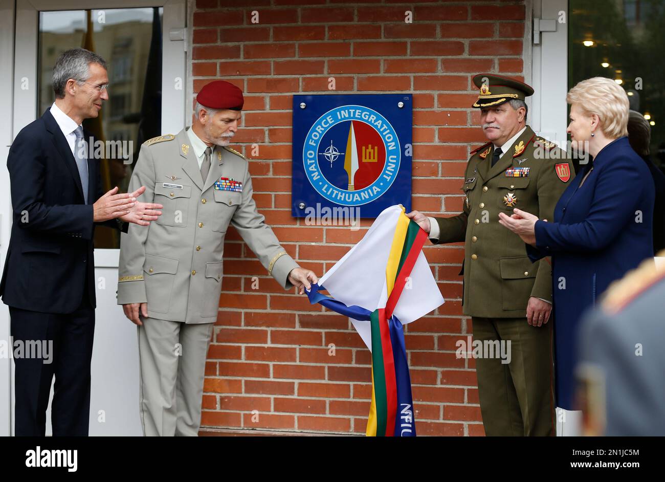 NATO Secretary General Jens Stoltenberg, left, Lithuania's President ...
