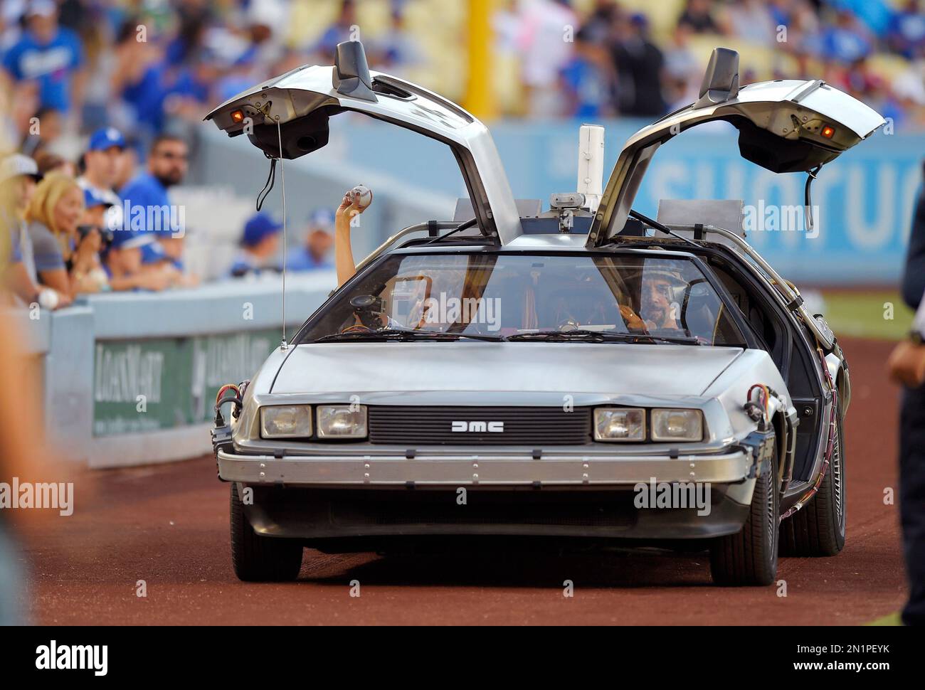Actress Lea Thompson, left, rides onto the field in a customized ...