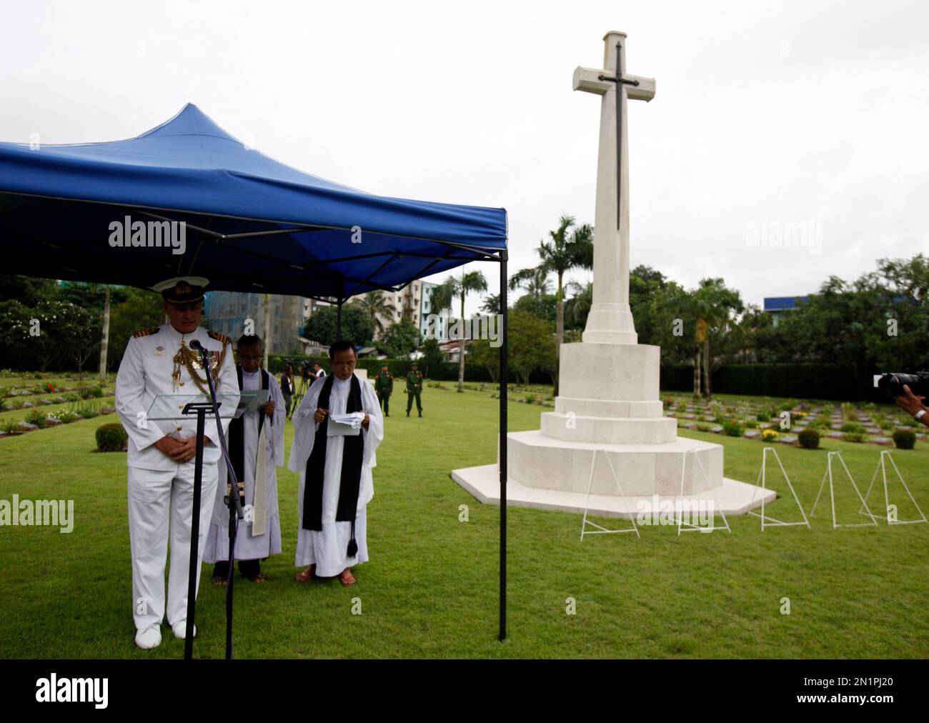 Captain Jon Dudley, left, Defence Attache of Australia, reads "Ode to ...