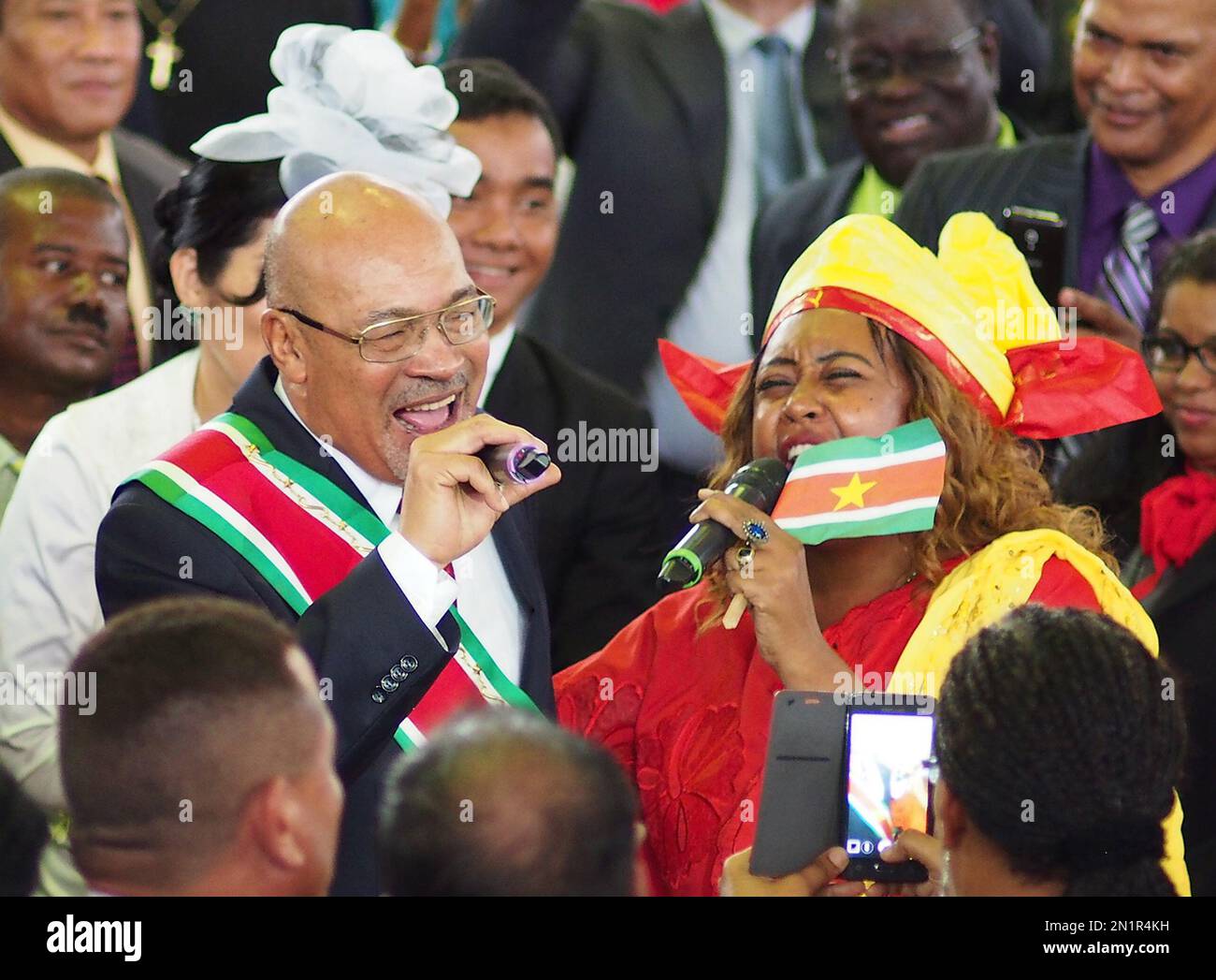 Suriname President Desire Delano Bouterse, left, sings Frank Sinatra's ...