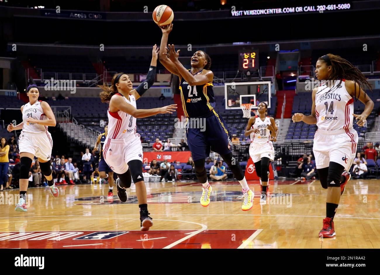 Indiana Fever forward Tamika Catchings (24) shoots between Washington ...