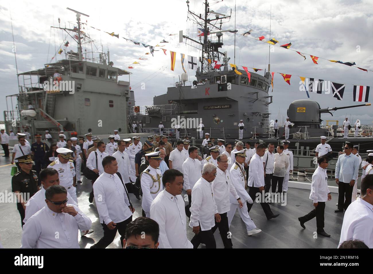 Philippine President Benigno Aquino III, center, walks with new ...