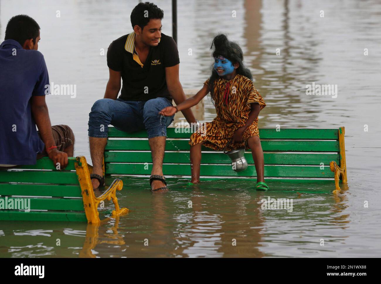 An Indian boy dressed as Hindu god Shiva to attract alms from devotees ...