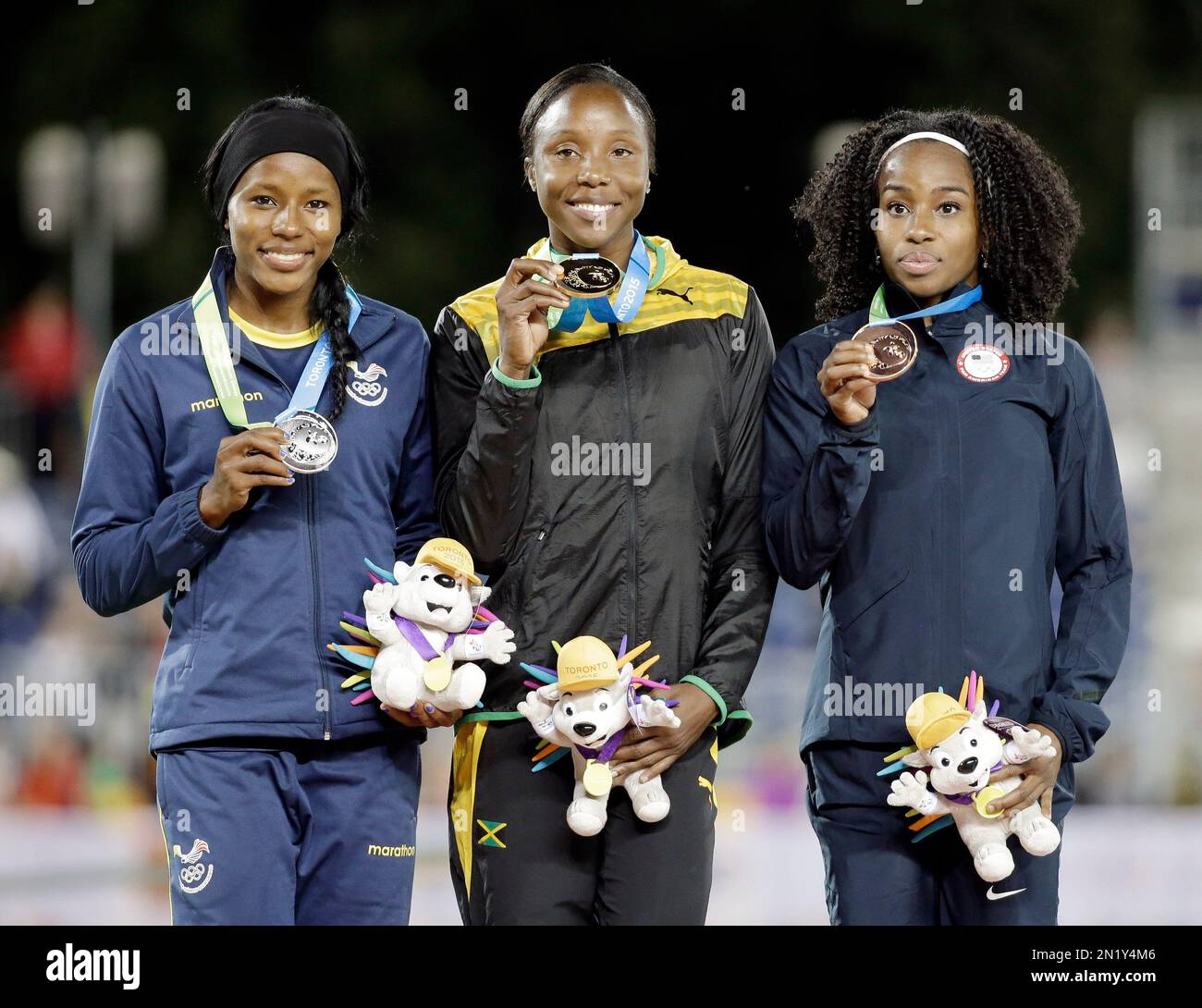 Gold medal winner Sherone Simpson of Jamaica, center, silver medal ...