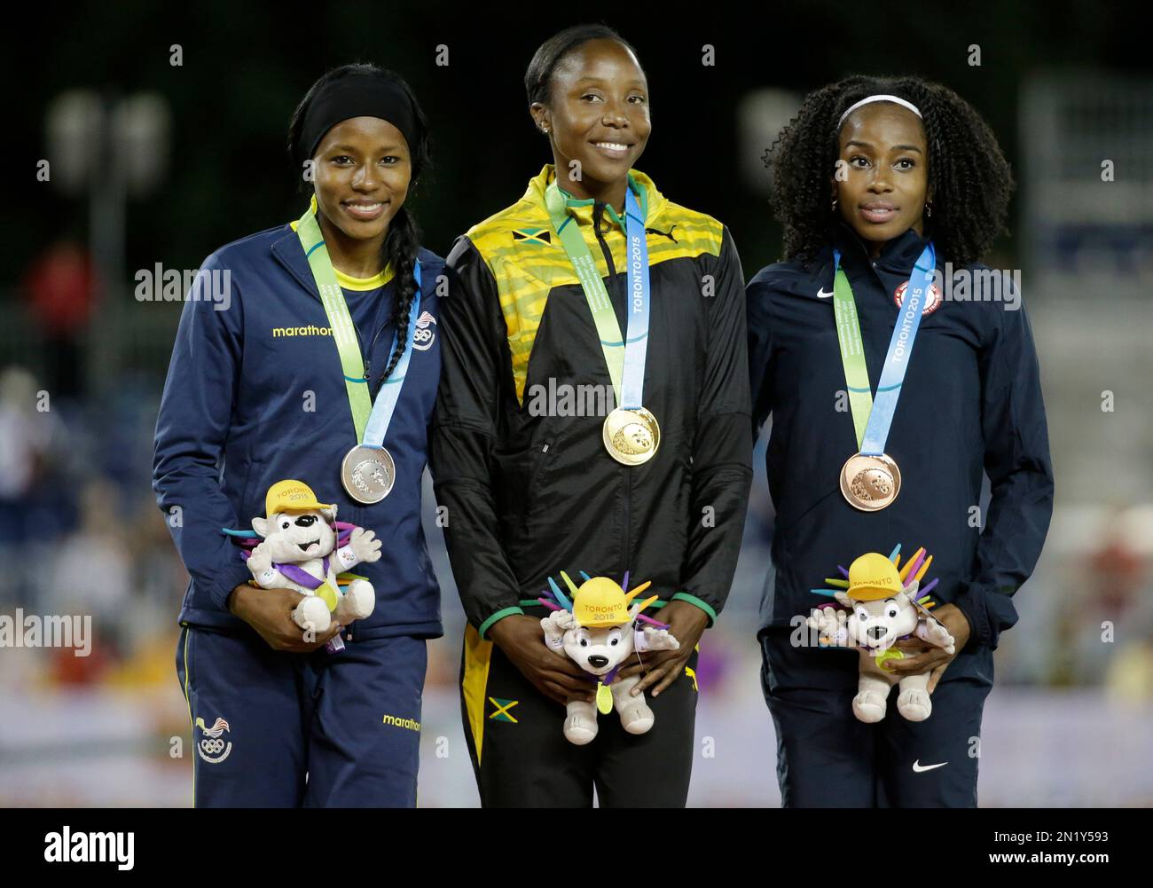 Gold medal winner Sherone Simpson of Jamaica, center, silver medal ...