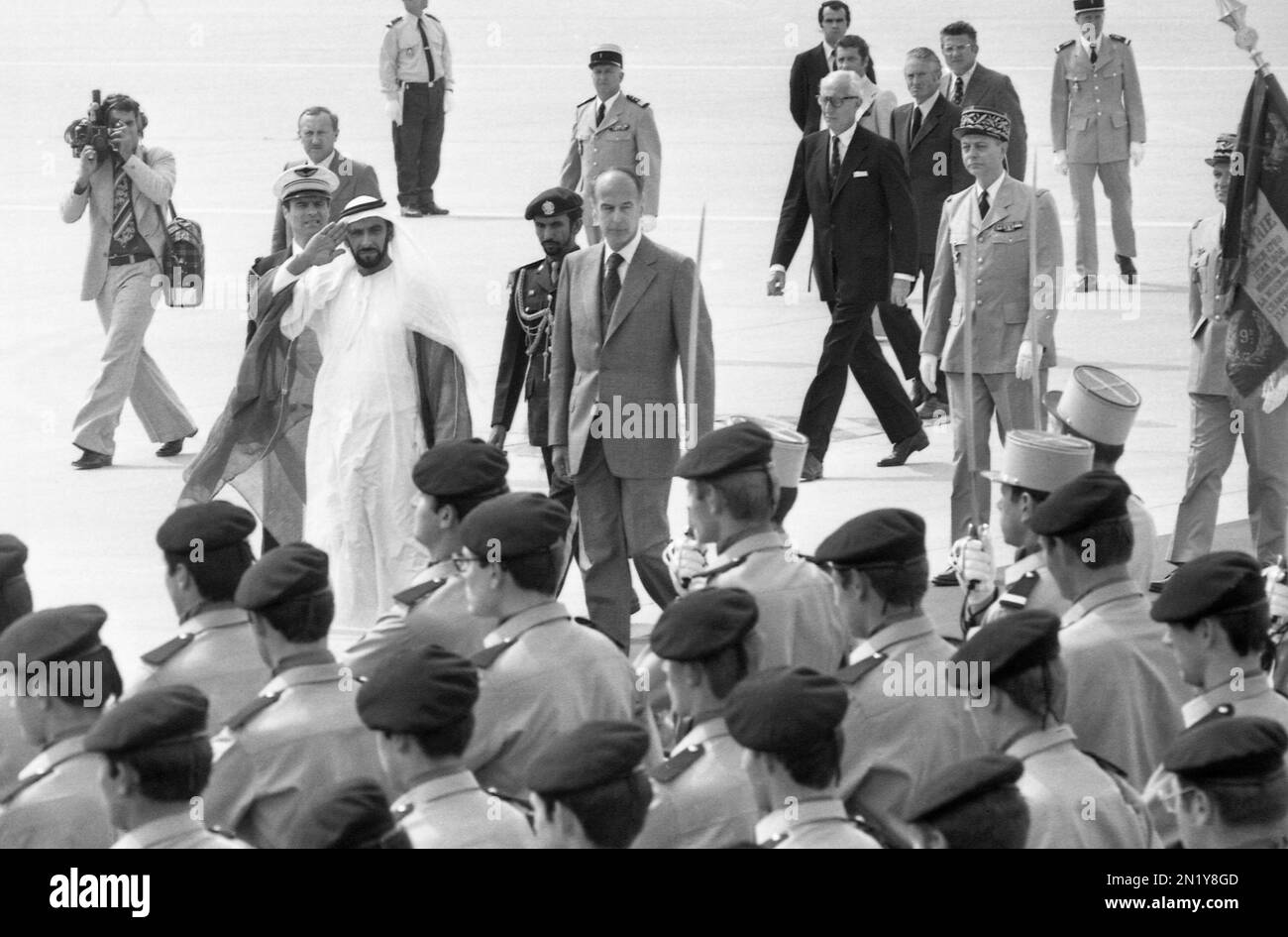 Sheikh Zayed bin Sultan Al Nahyan salutes soldiers as he walks with ...