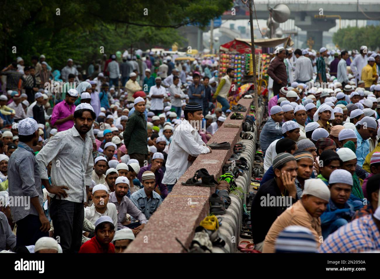 Indian Muslim men wait for the Imam to begin the last Friday prayers of ...