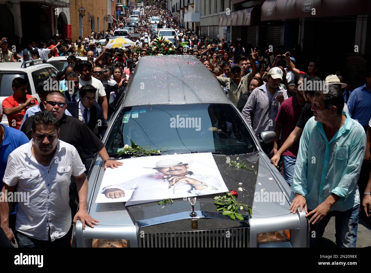A hearse transporting the coffin containing the remains of Mexican ...