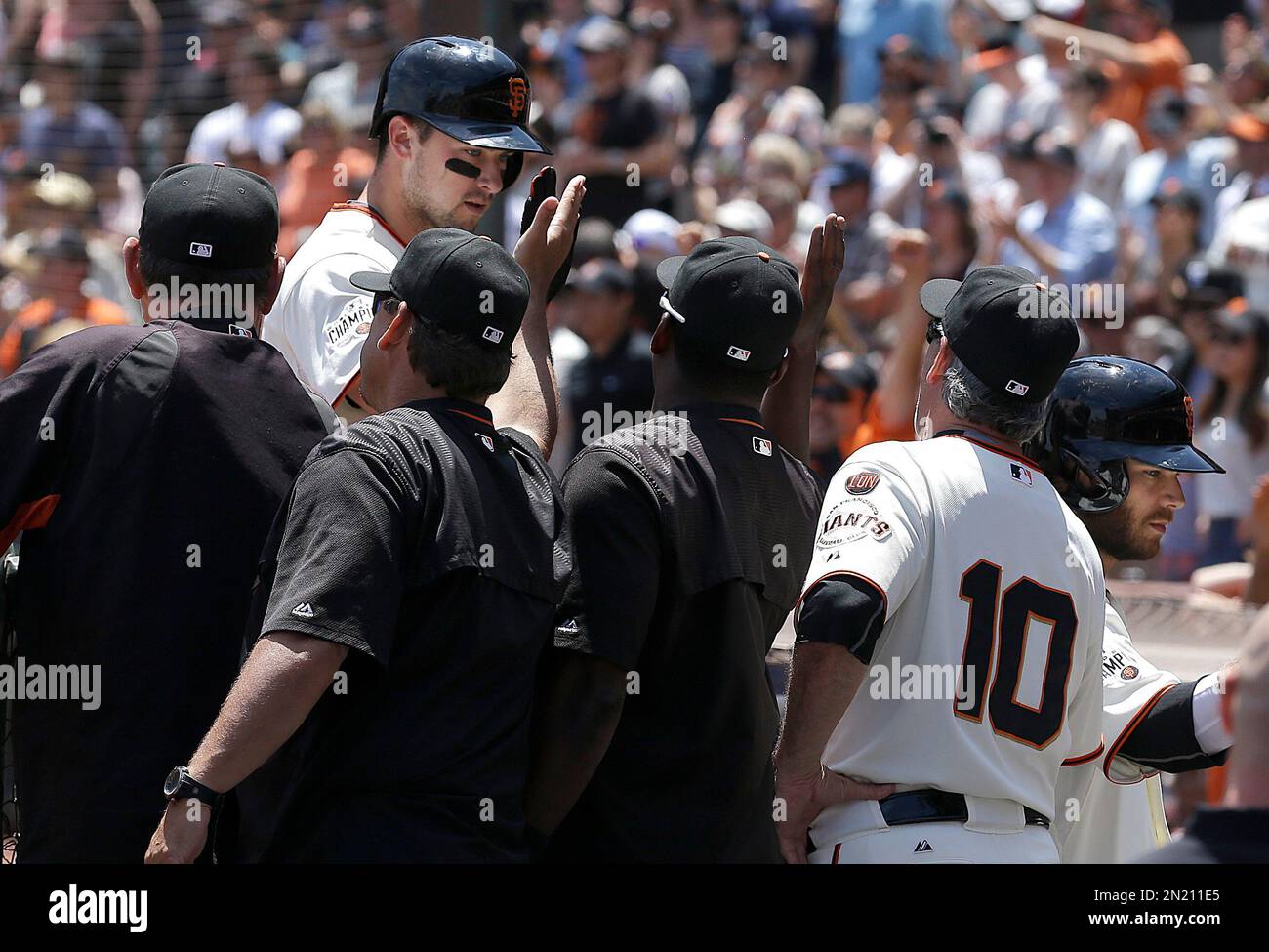 San Francisco Giants' Andrew Susac, top, is congratulated after hitting ...