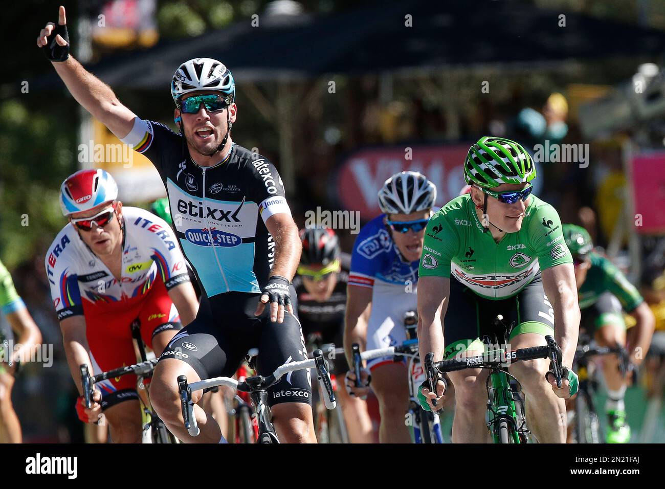 Britain's sprinter Mark Cavendish celebrates as he crosses the finish ...