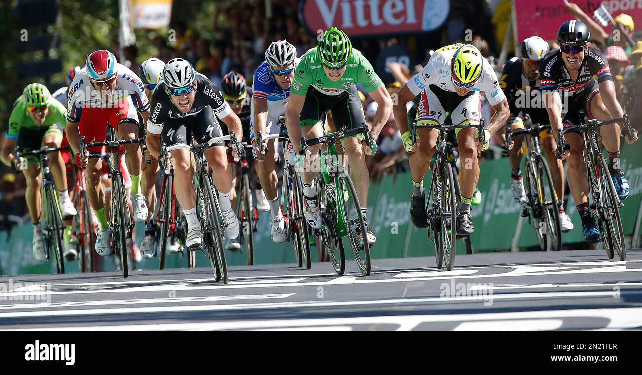 Britain's sprinter Mark Cavendish, center left in black and blue jersey ...