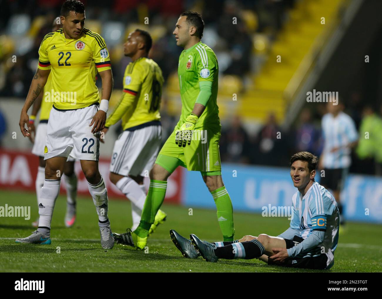 Argentina's Lionel Messi, ground, gestures beside Colombia's goalkeeper ...