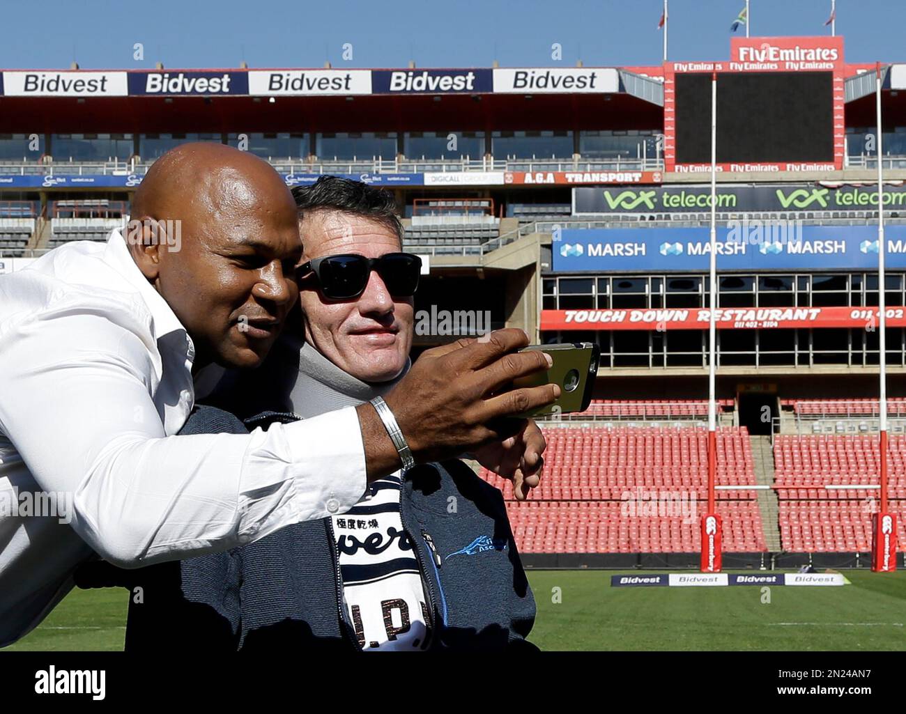 Former rugby players Chester Williams, left, with teammate Joost van ...