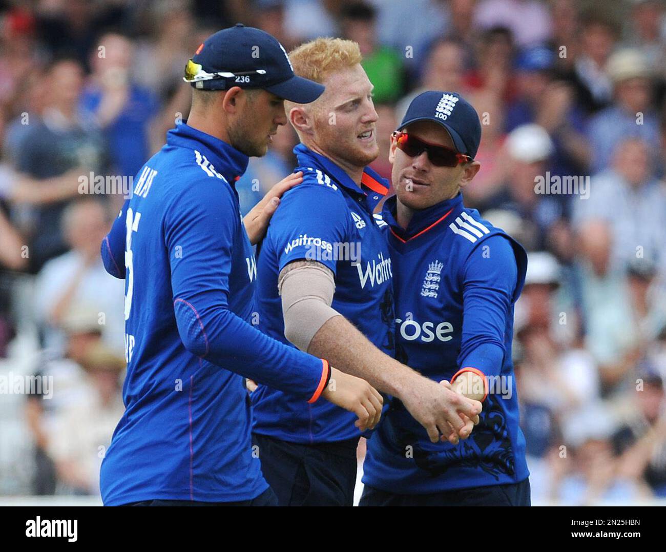 England's Ben Stokes, centre, is congratulated by captain Eoin Morgan ...