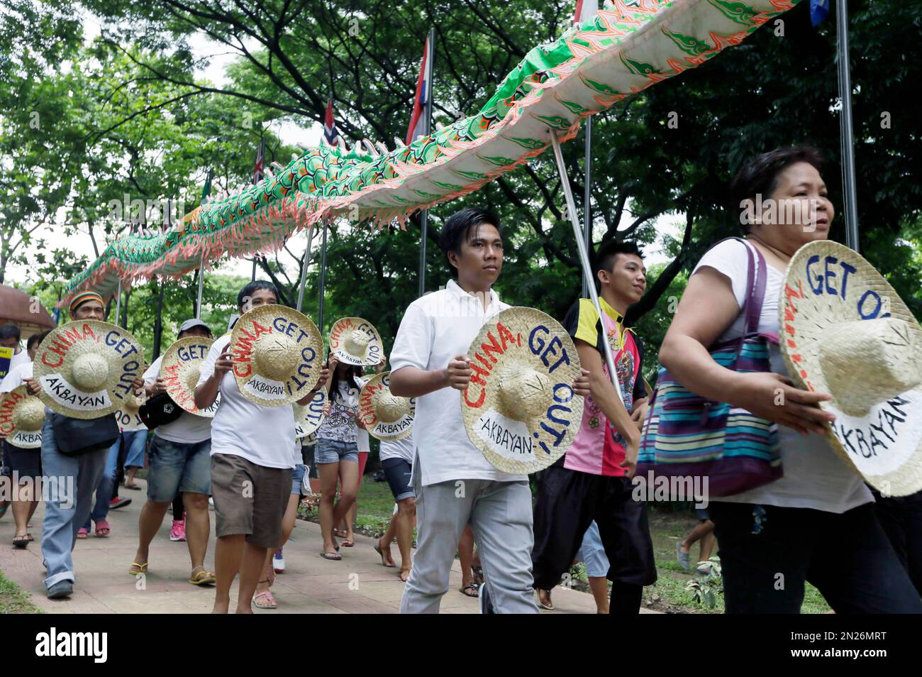 Protesters display traditional hats with anti-China messages as a ...