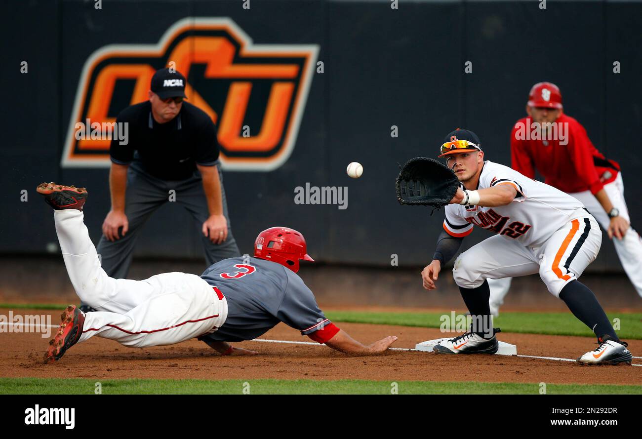 Oklahoma State first baseman Dustin Williams reaches out for the throw ...