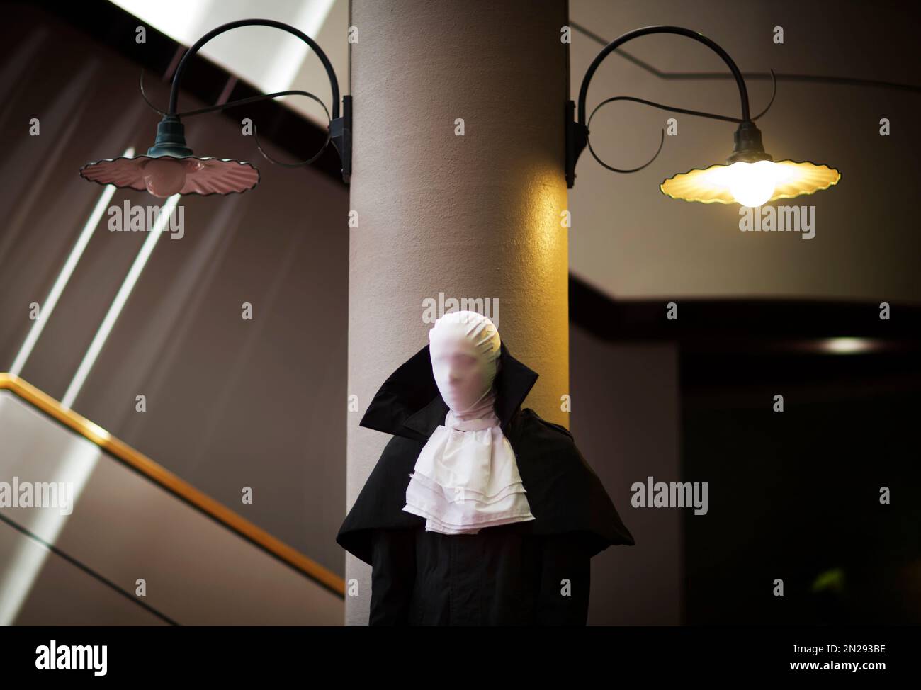 John Cason, dressed as the character Cabadath stands on the hall floor ...