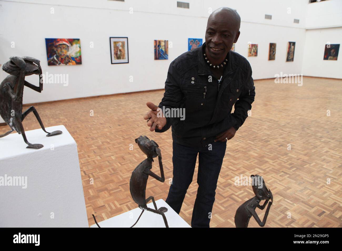Raphael Chikukwa, curator of the National Gallery of Zimbabwe, shows ...